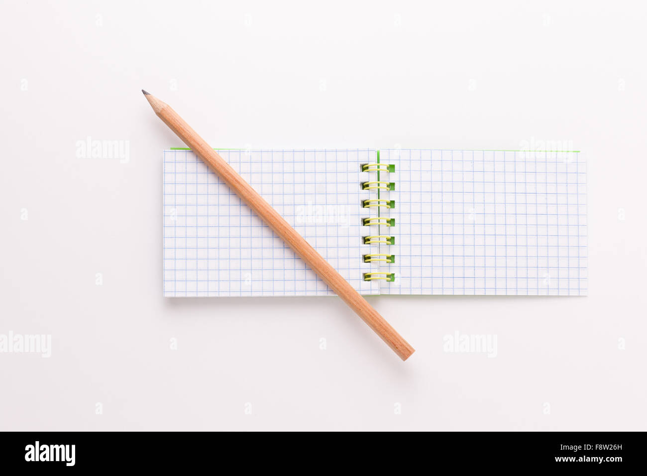 notepad on a white background with a sharp pencil Stock Photo - Alamy