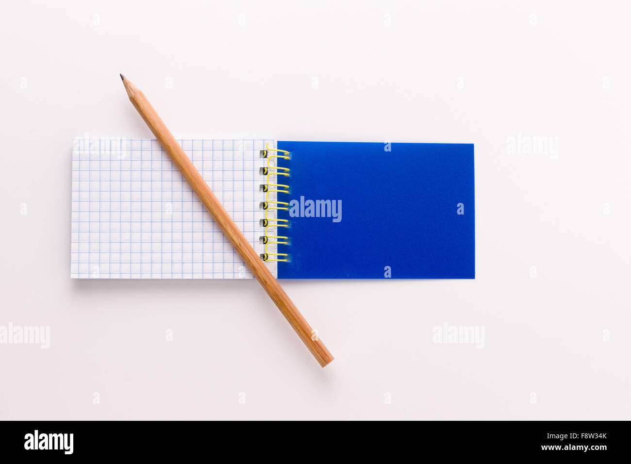 notepad on a white background with a sharp pencil Stock Photo - Alamy
