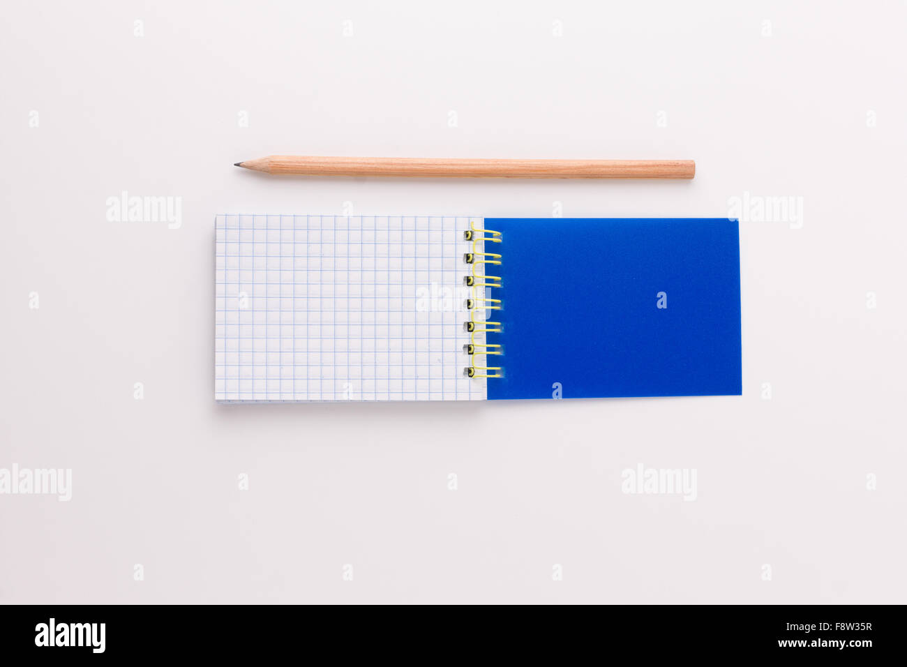 notepad on a white background with a sharp pencil Stock Photo - Alamy