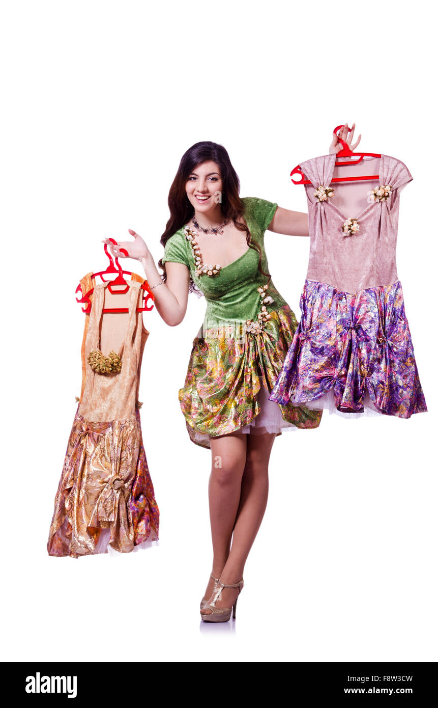 Woman trying to choose dress on white Stock Photo - Alamy