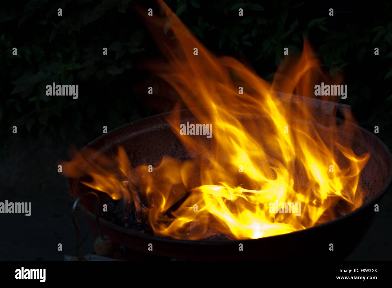 flames from a fire in the grill Stock Photo - Alamy