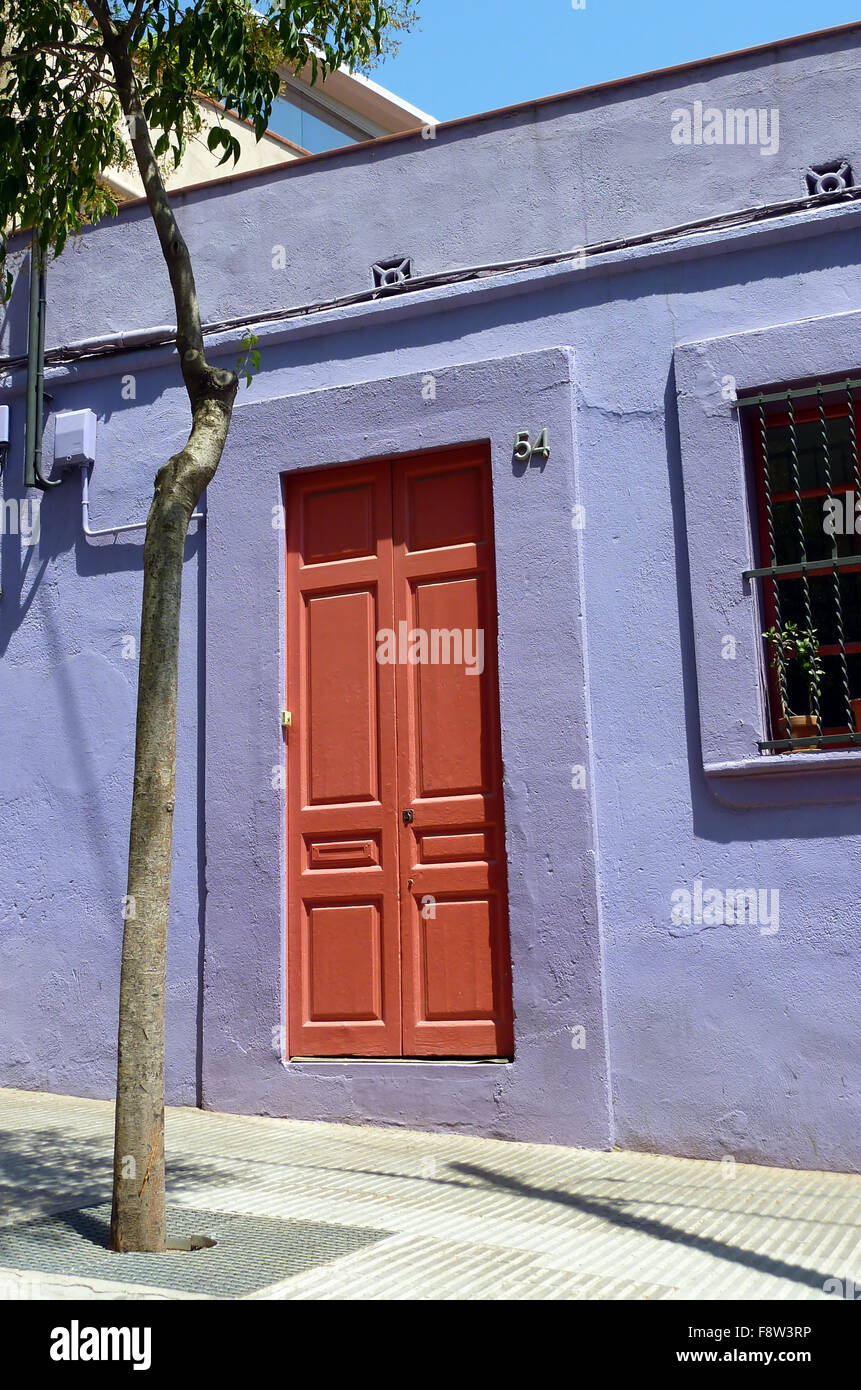 Red door and violet wall Stock Photo - Alamy