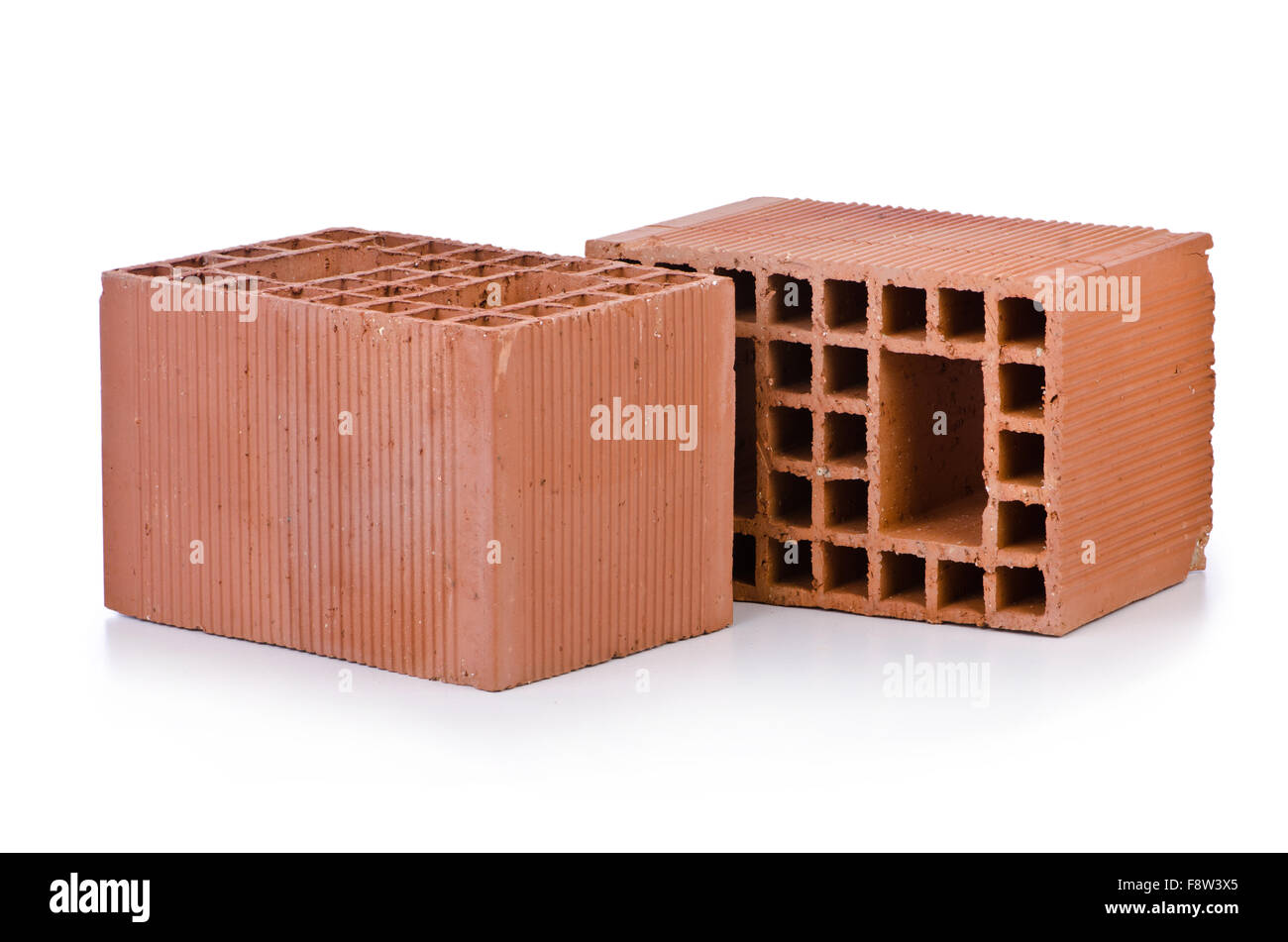 Stack of clay bricks isolated on white Stock Photo - Alamy