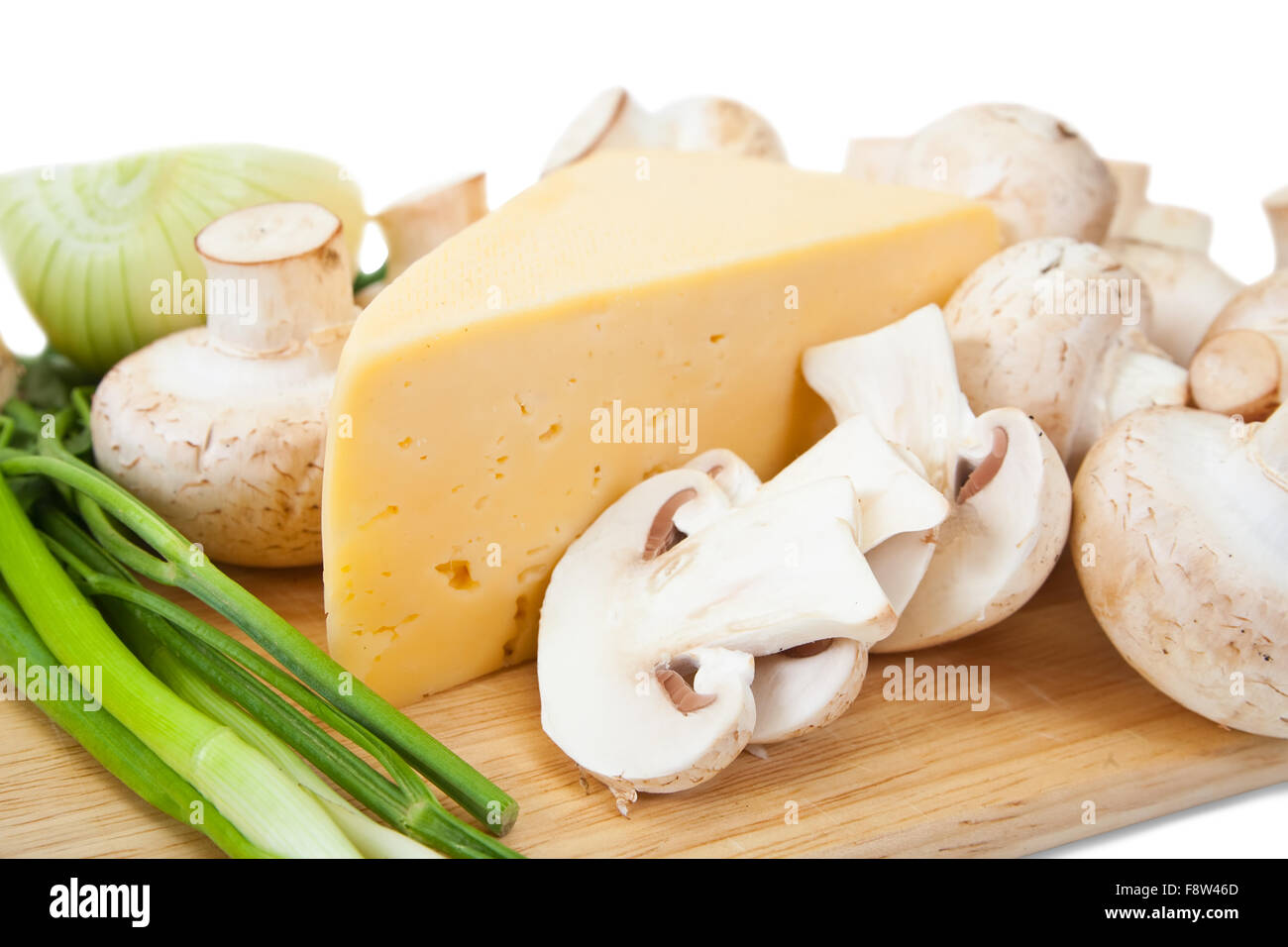 Closeup of champignon mushroom with cheese on cutting board Stock Photo ...