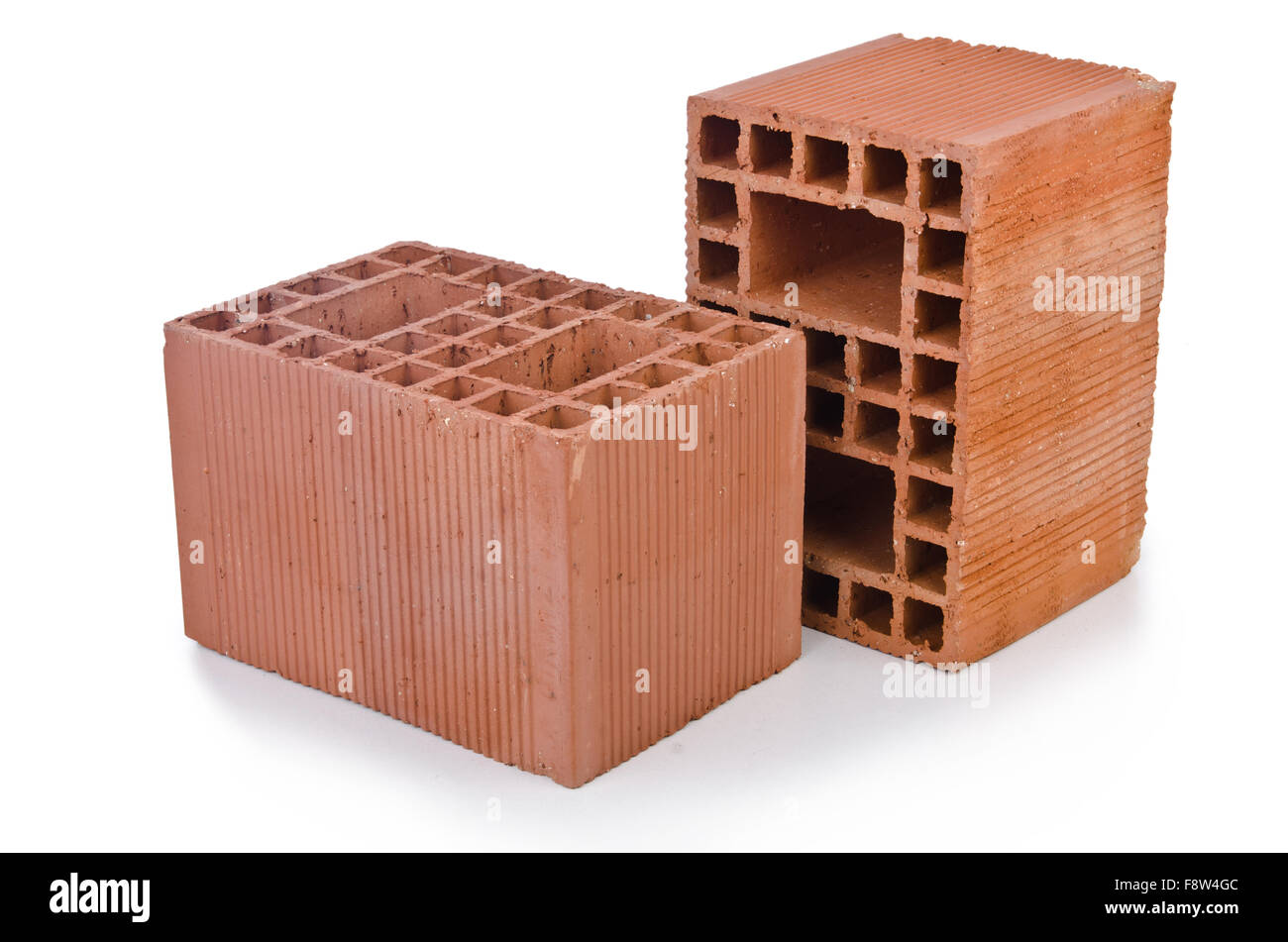 Stack of clay bricks isolated on white Stock Photo - Alamy