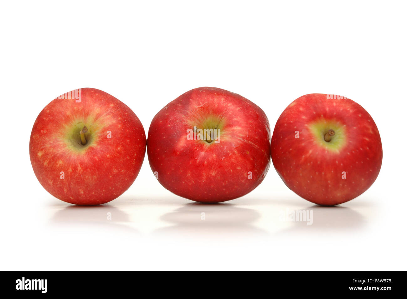 Three red apples isolated on white Stock Photo - Alamy