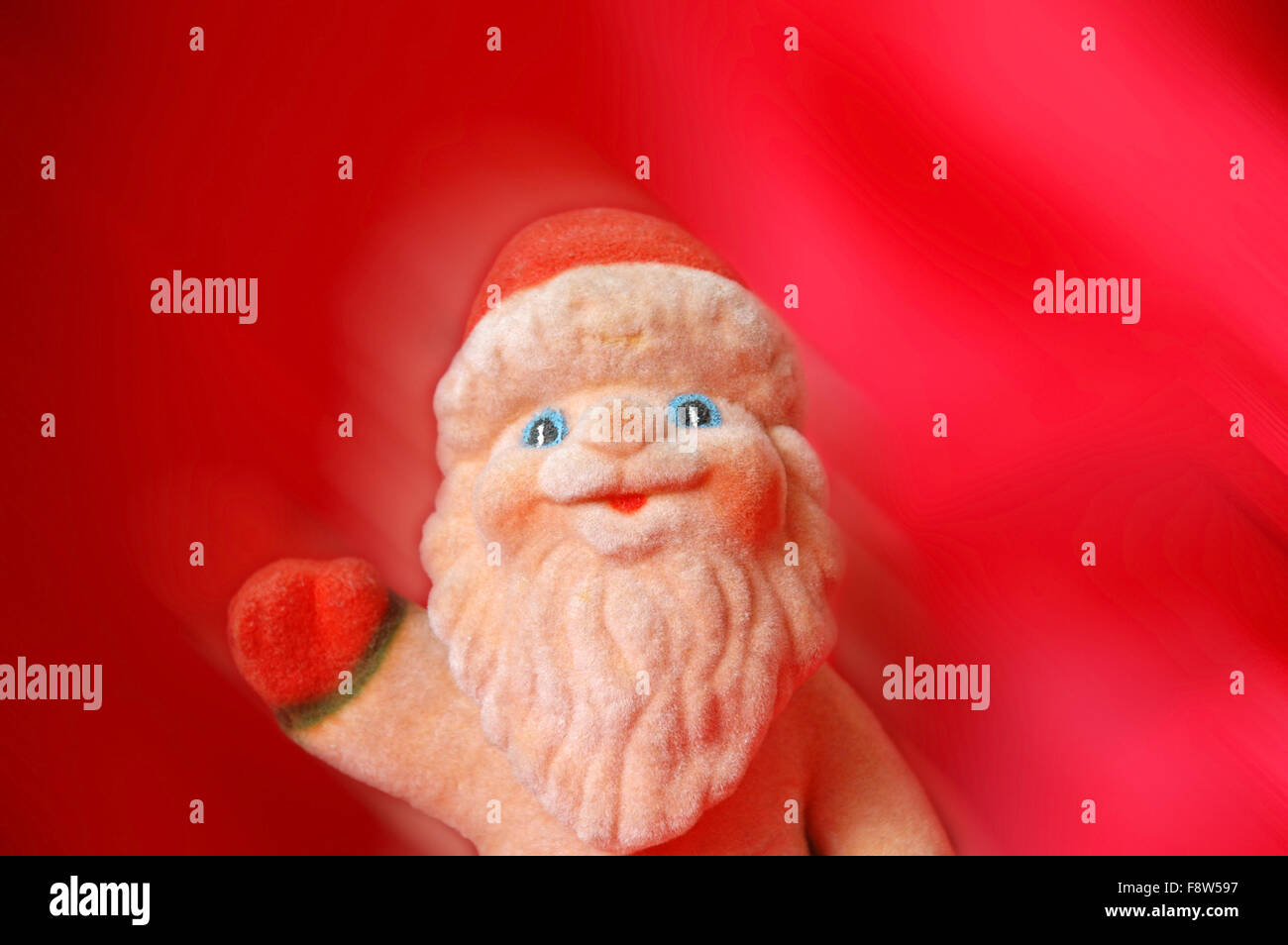 Santa Claus on red background - motion blurred Stock Photo - Alamy