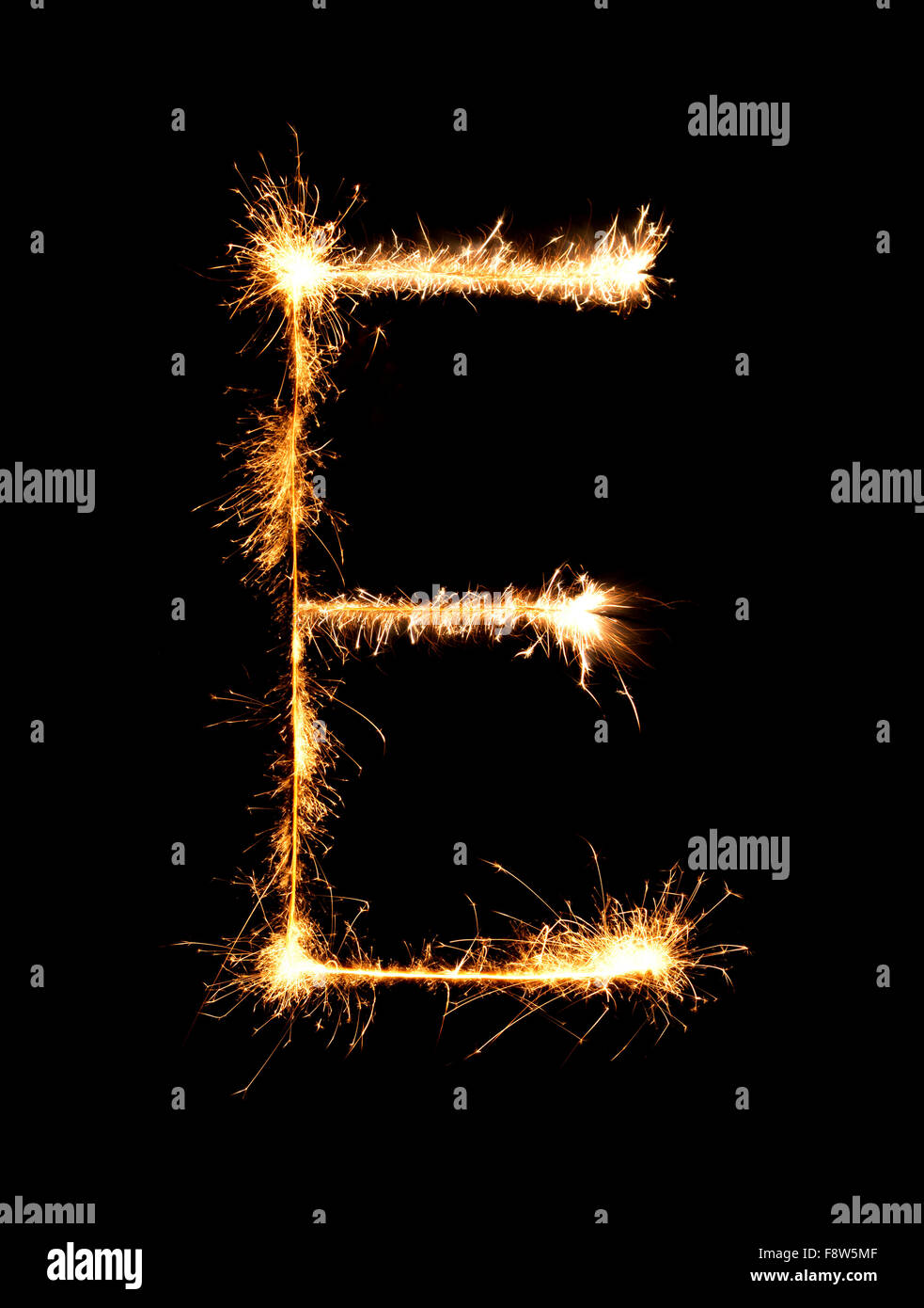 Sparkler firework light alphabet E (Capital Letters) at night ...