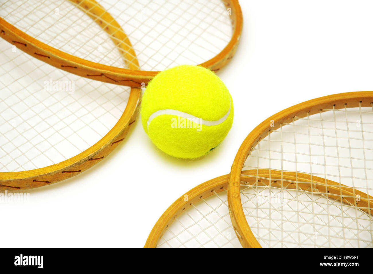 Four tennis rackets and balls isolated on white Stock Photo - Alamy