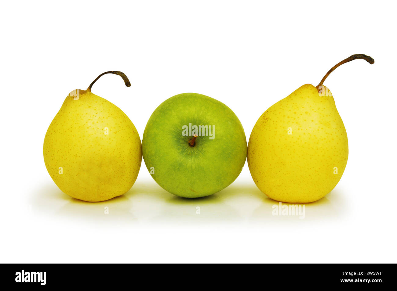 Two yellow pears and green apple isolated on white Stock Photo - Alamy