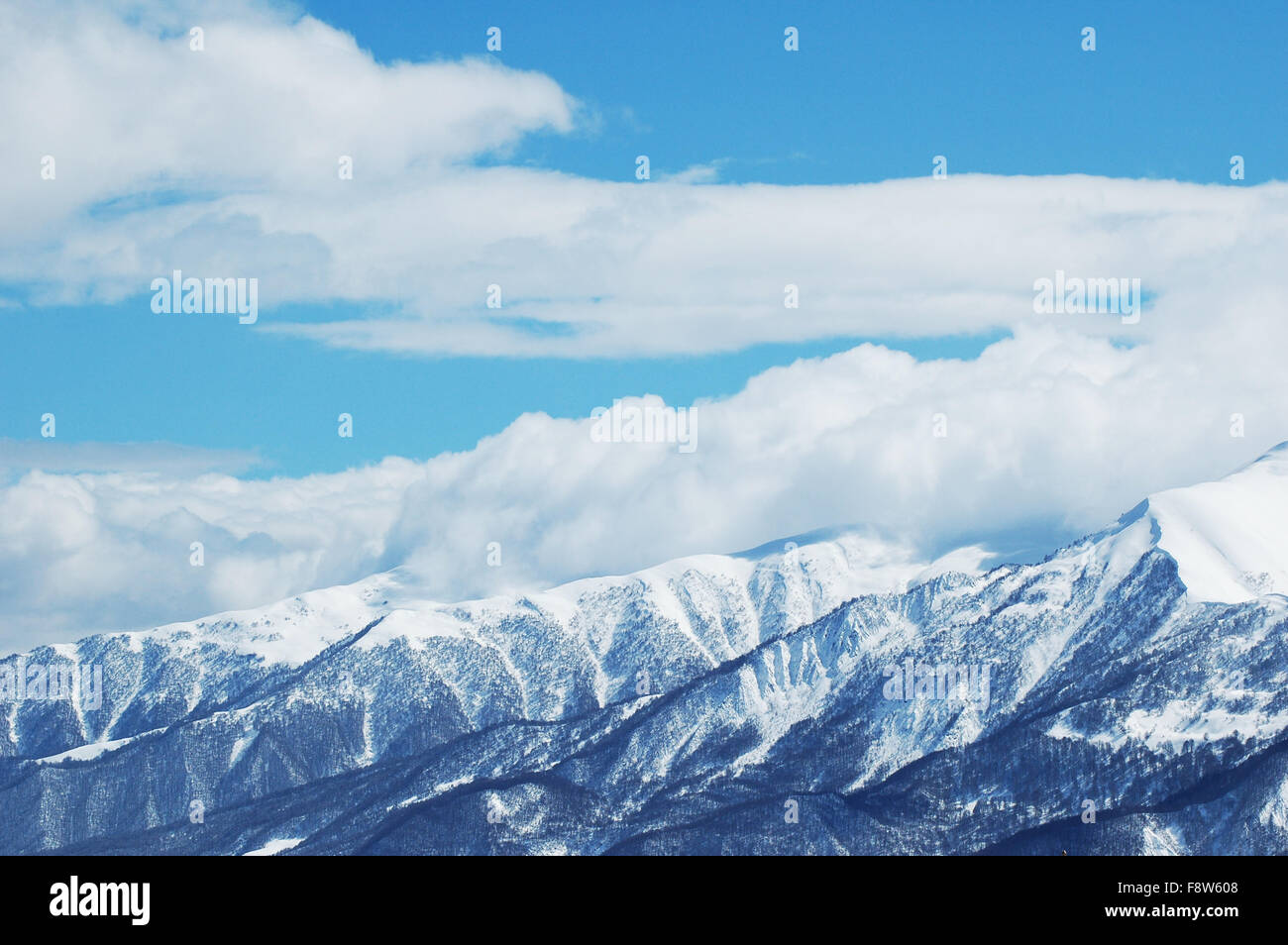 Mountains under snow in bright winter day Stock Photo - Alamy