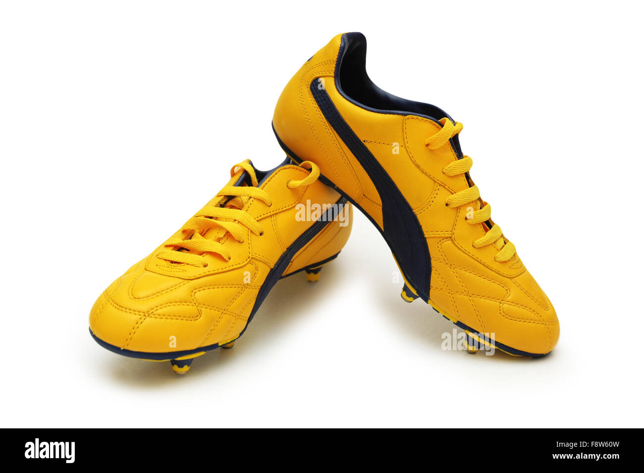 Yellow football boots isolated on the white Stock Photo - Alamy