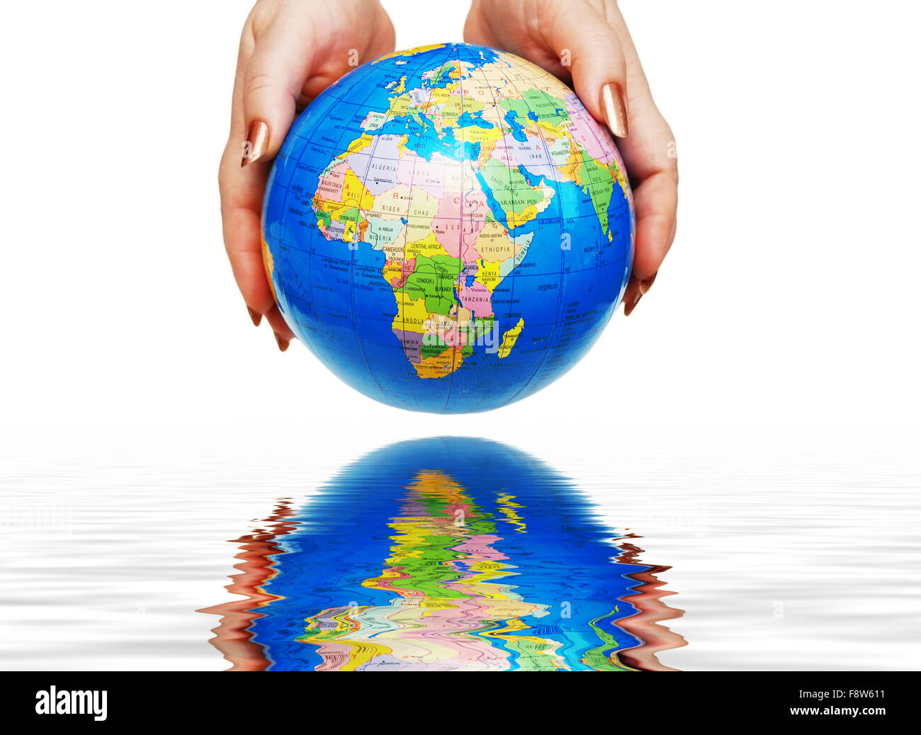 Two hands holding a globe isolated on white with reflection in the ...