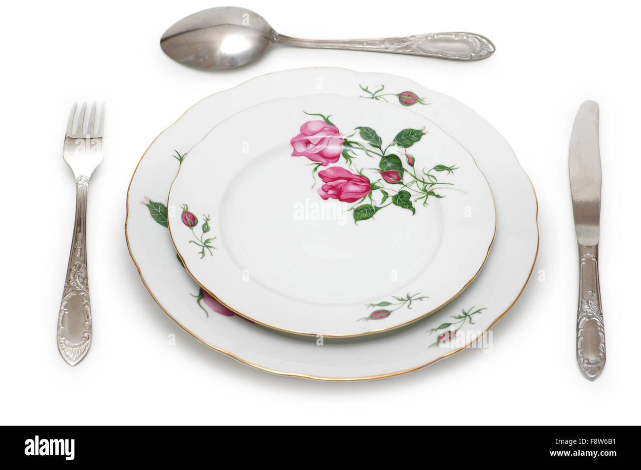 Plate and table utensils isolated on white Stock Photo - Alamy