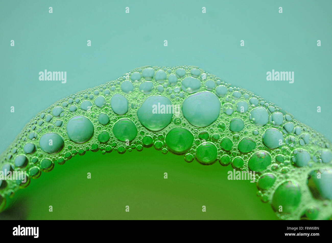 Foam bubbles on blue and green background Stock Photo - Alamy