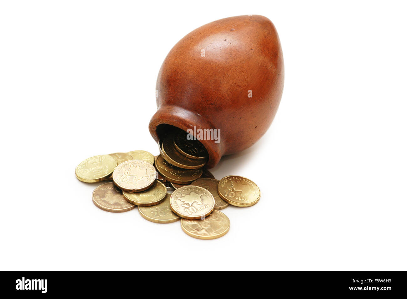 Clay pot and coins isolated on white Stock Photo - Alamy