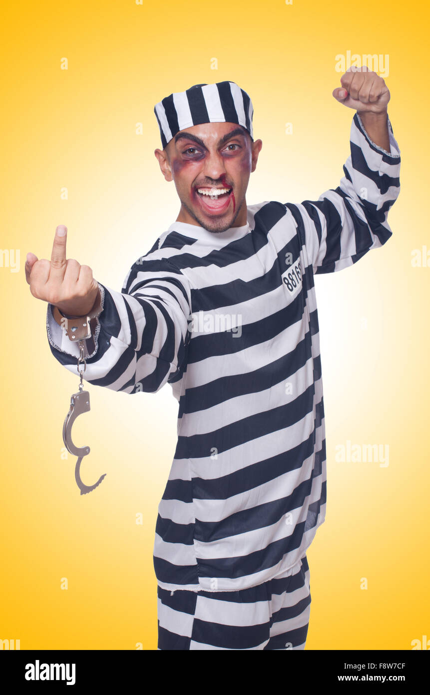 Badly bruised prisoner with handcuffs Stock Photo - Alamy