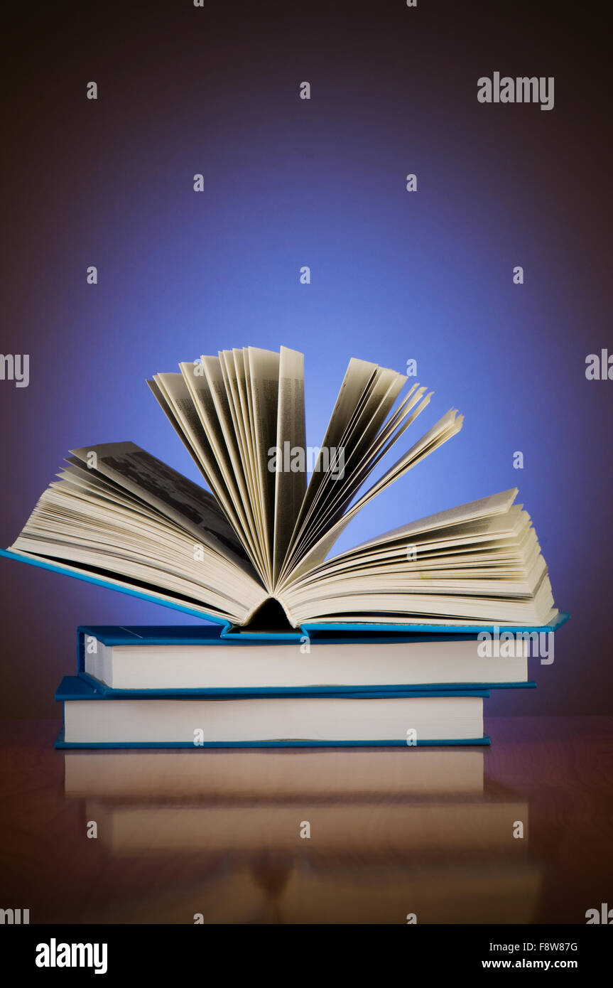 Stack of books against gradient background Stock Photo - Alamy