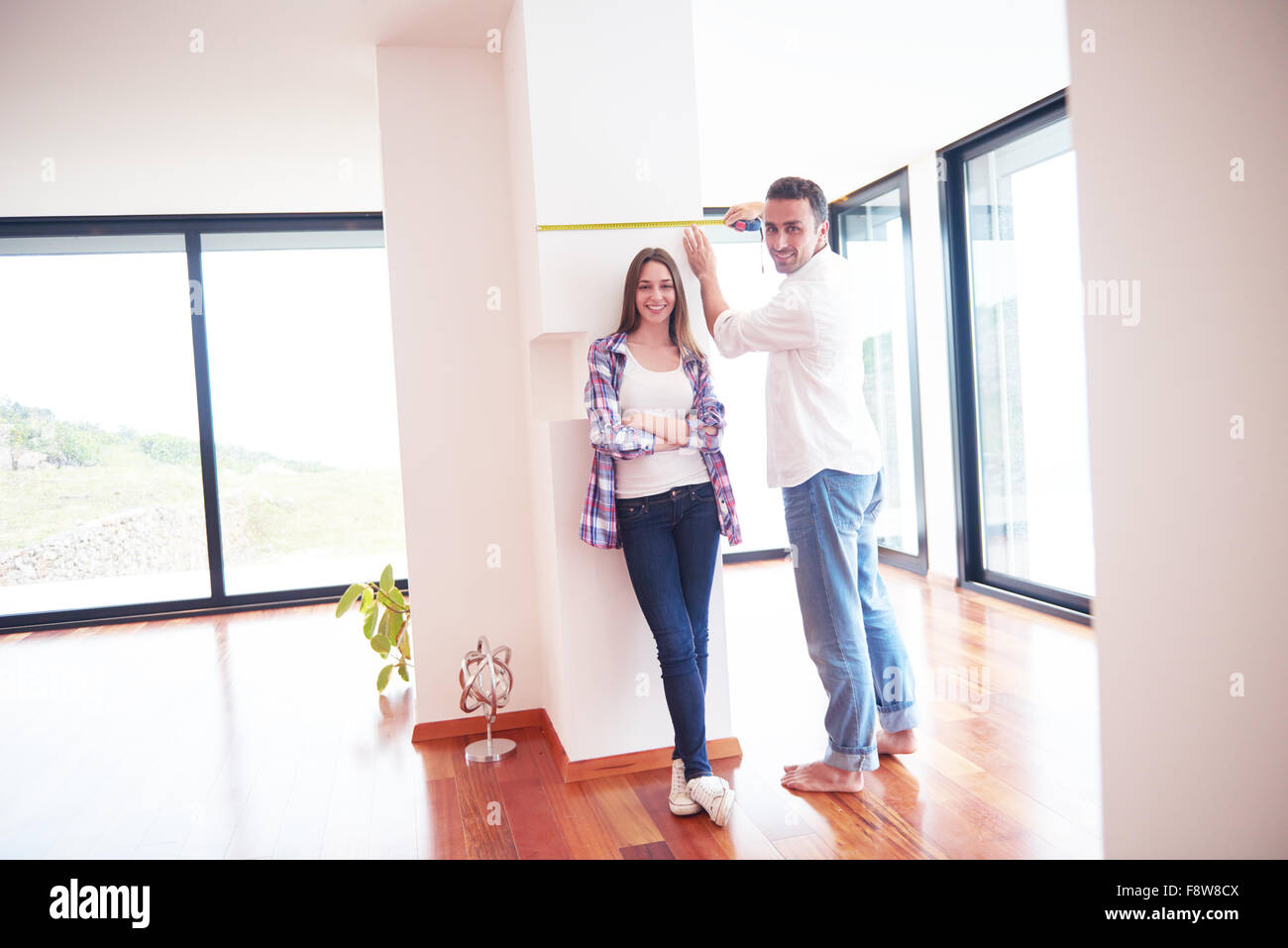 happy young romantic couple at new modern home interior renovation ...