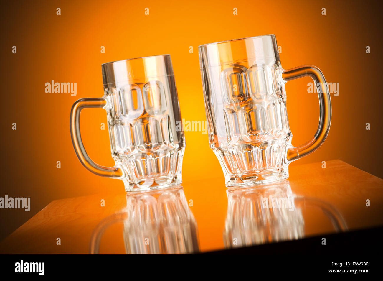 Beer glass against gradient background Stock Photo - Alamy