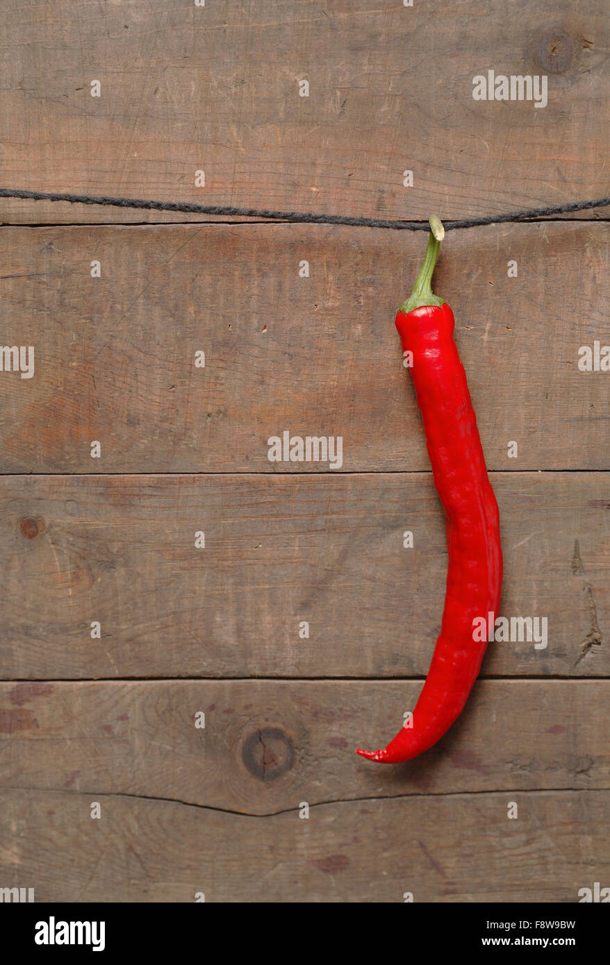 Chili Pepper Hanging On Rope Stock Photo - Alamy