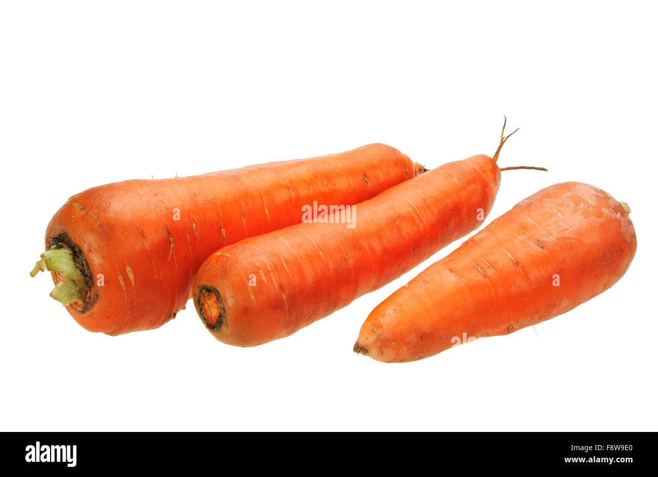 Three orange carrots Stock Photo - Alamy