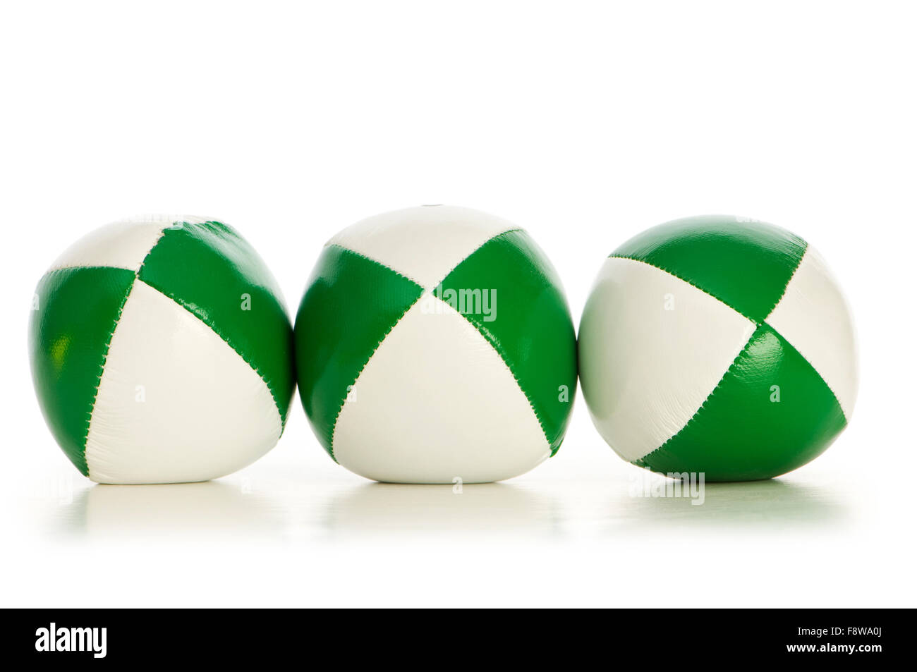 Green stress balls isolated on the white Stock Photo - Alamy
