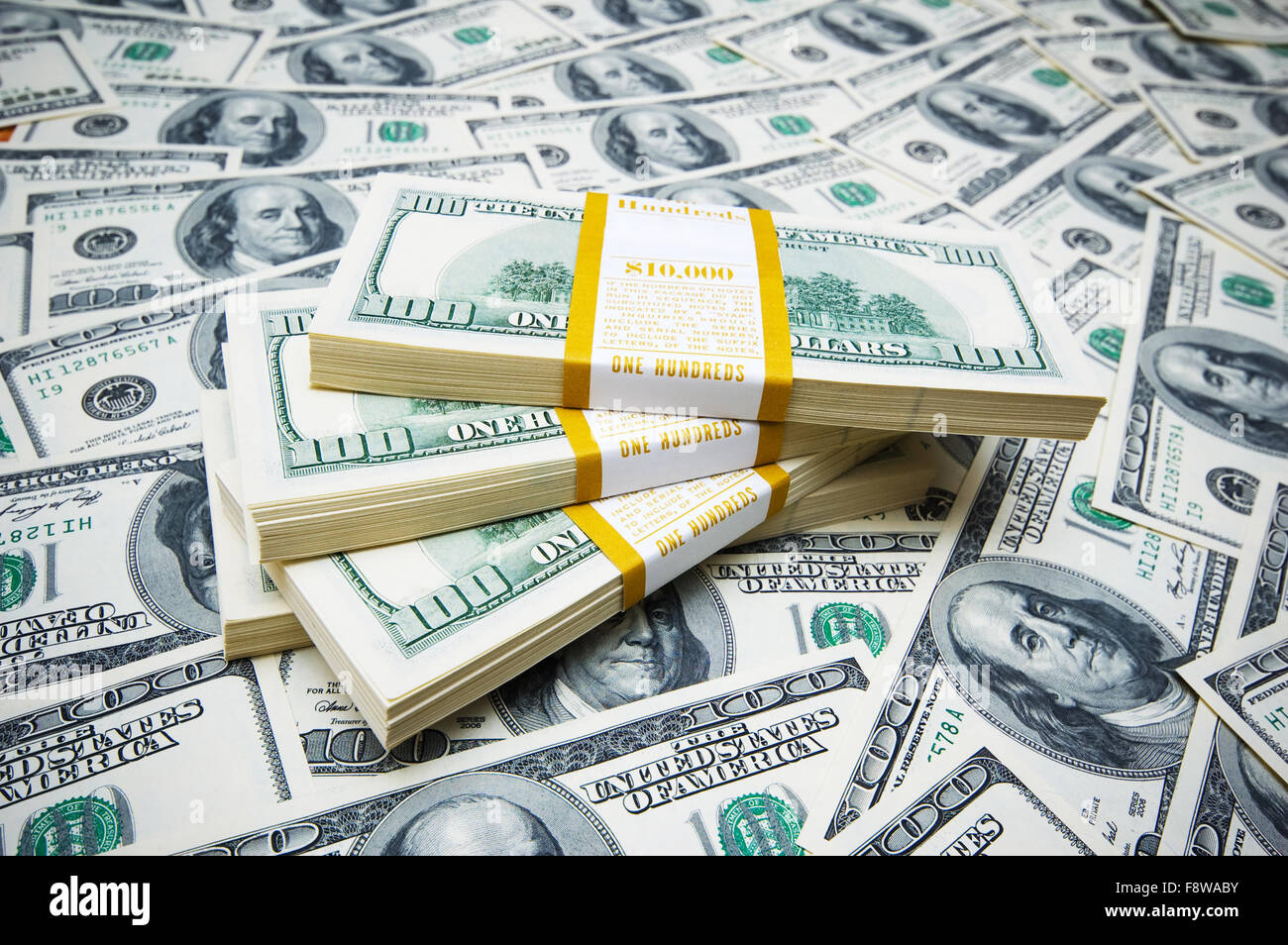 Stack of dollars on money background Stock Photo - Alamy