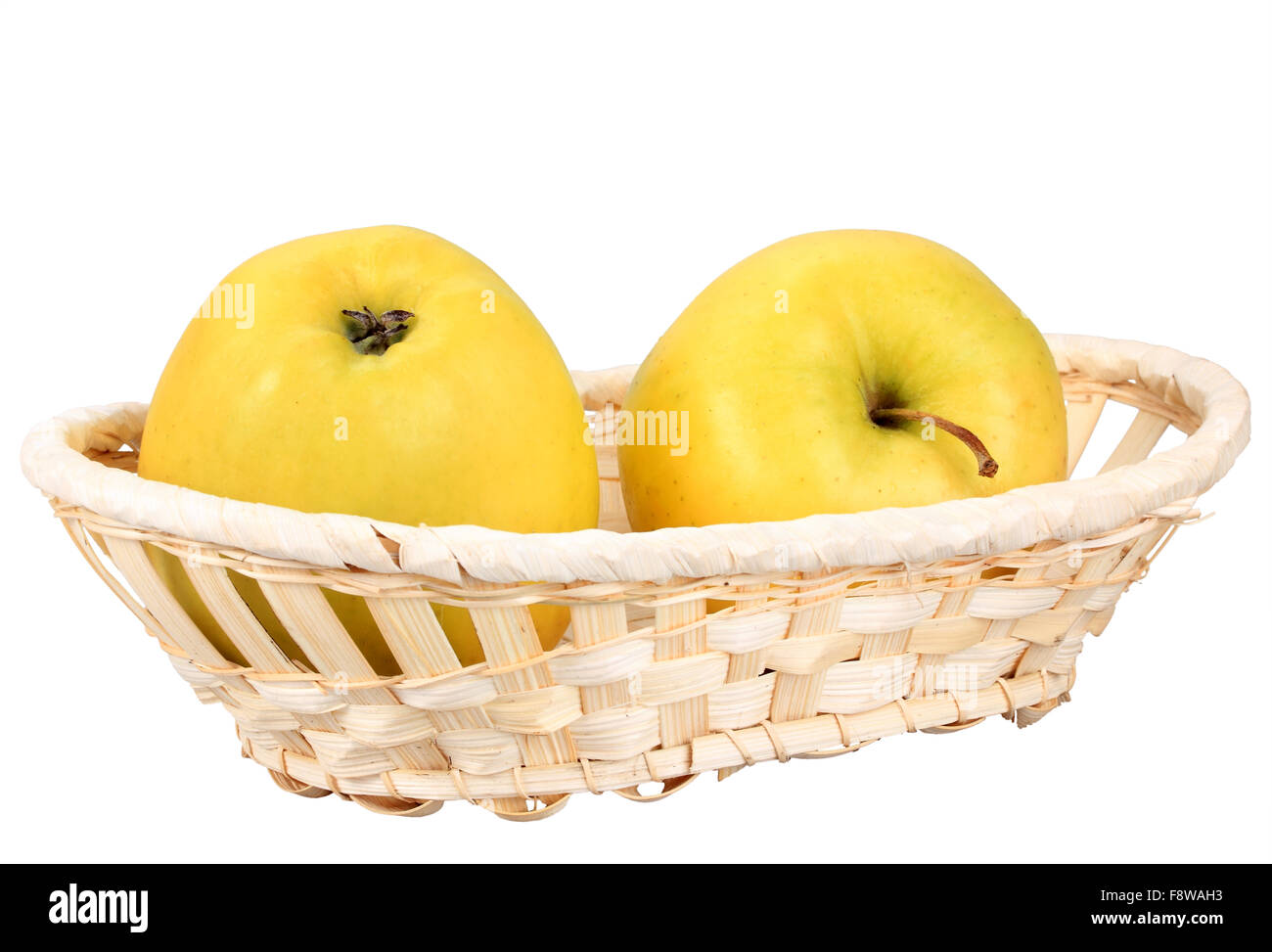 Two yellow apples in basket Stock Photo - Alamy