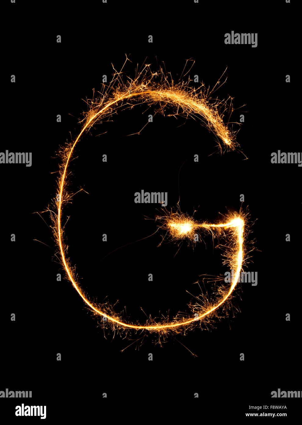 Sparkler firework light alphabet G (Capital Letters) at night ...