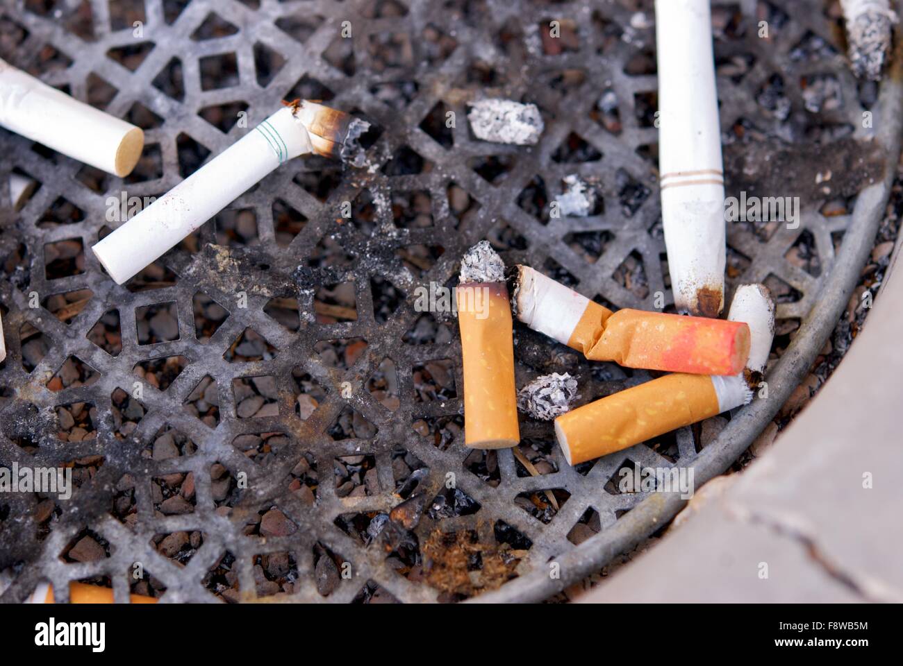 Cigarette Ashtray with Used Filters Stock Photo - Alamy