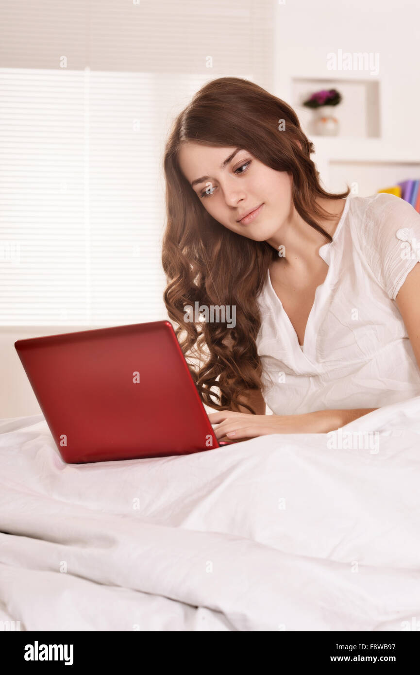 beautiful woman in bed with laptop Stock Photo - Alamy