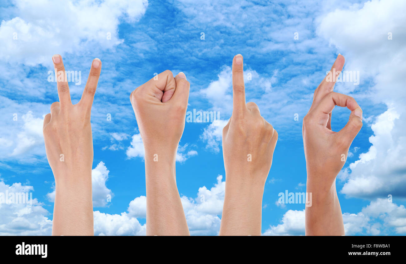 hands forming number 2016, as the new year, with blue sky background ...