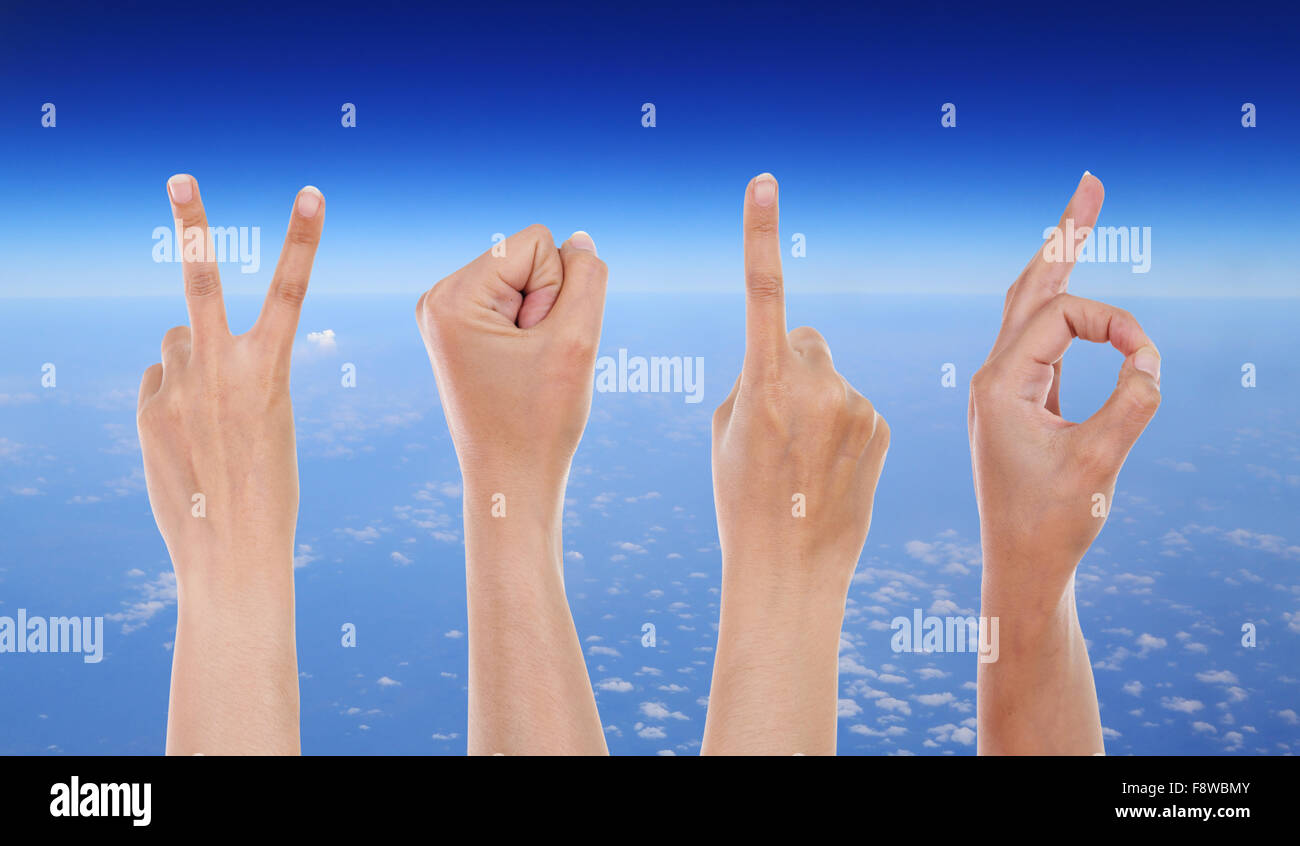 hands forming number 2016, as the new year, with blue sky background ...