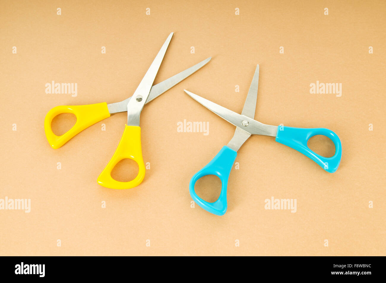 Colorful scissors on the color paper background Stock Photo - Alamy
