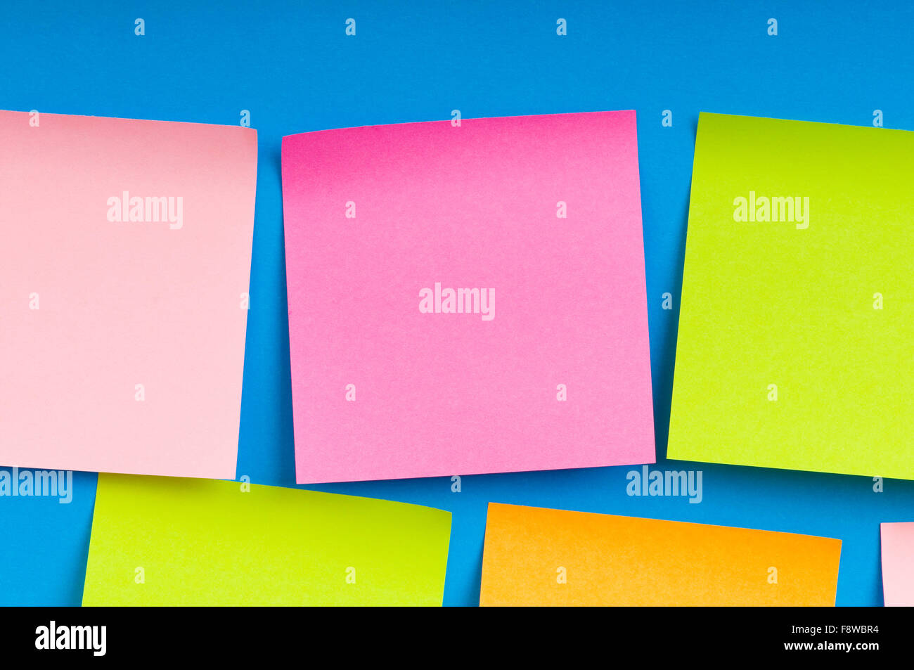 Reminder notes on the bright colorful paper Stock Photo - Alamy