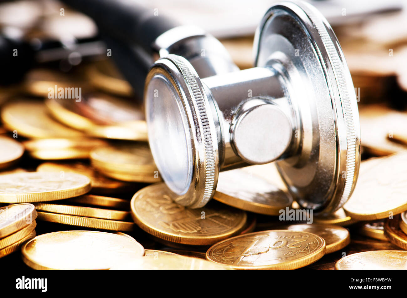 Concept of expensive healthcare with coins and stethoscope Stock Photo ...