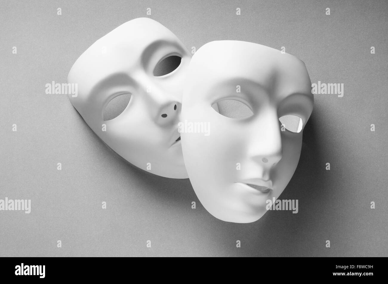 Theatre concept with the white plastic masks Stock Photo - Alamy