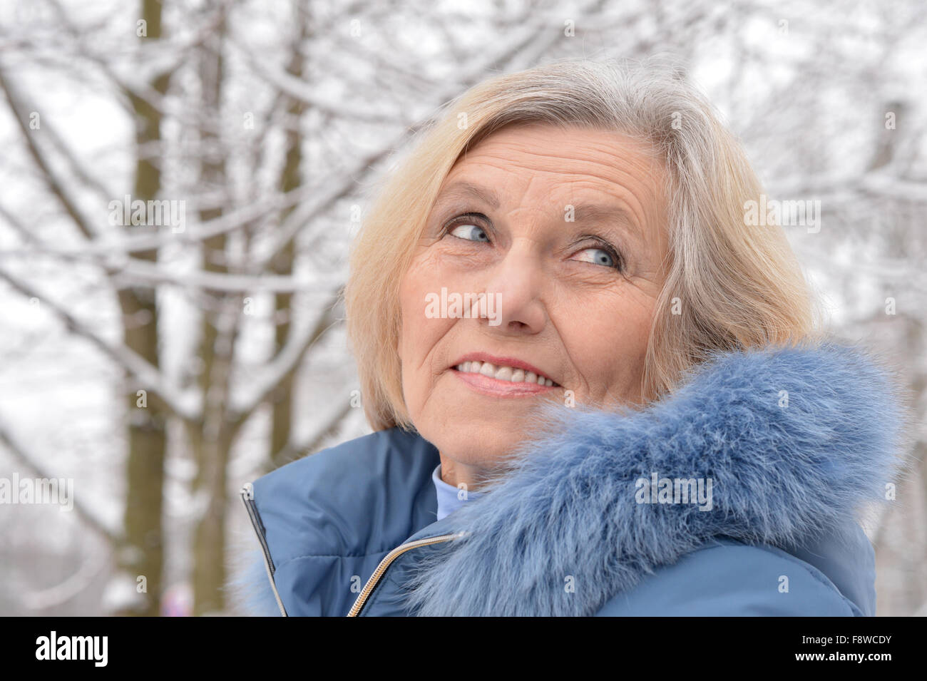 Old woman in the winter Stock Photo - Alamy