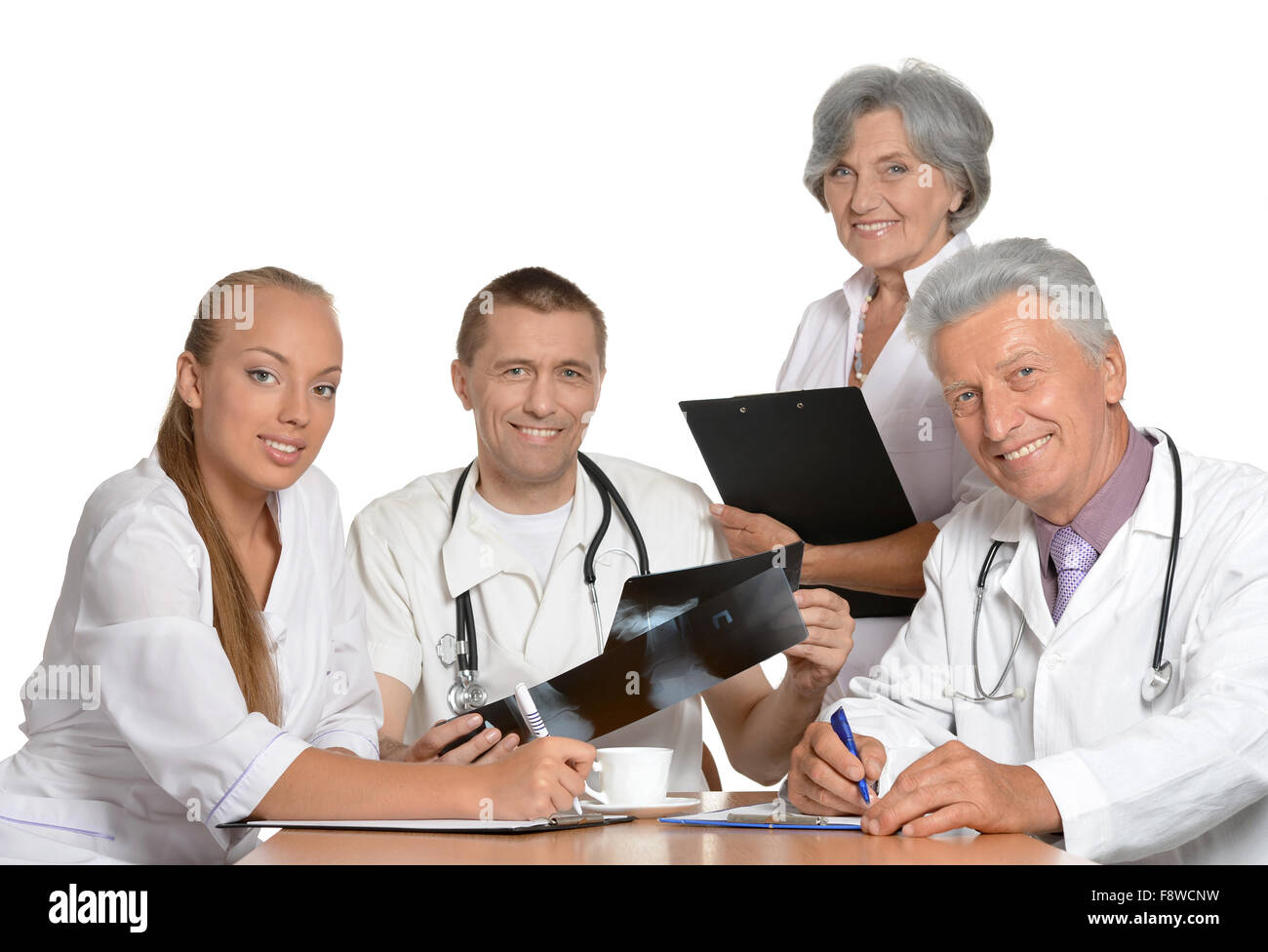 Doctors discussing at table Stock Photo - Alamy