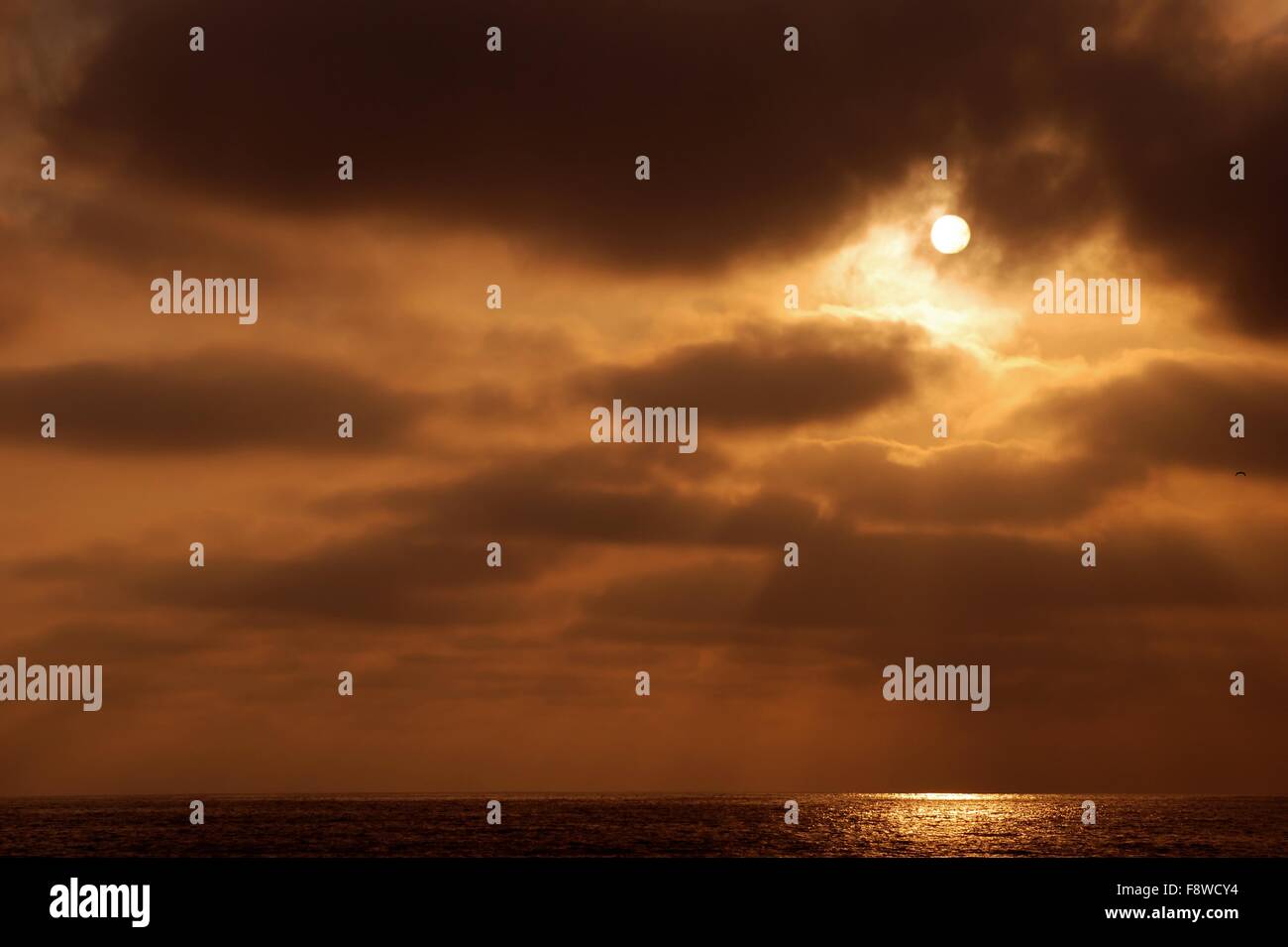 Orange Sun Over Pacific Ocean Stock Photo - Alamy