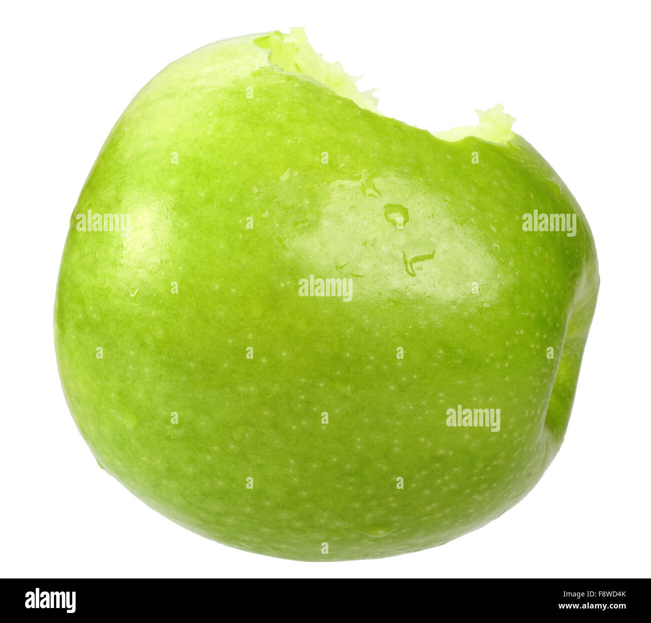 Single a green apple with bite Stock Photo - Alamy