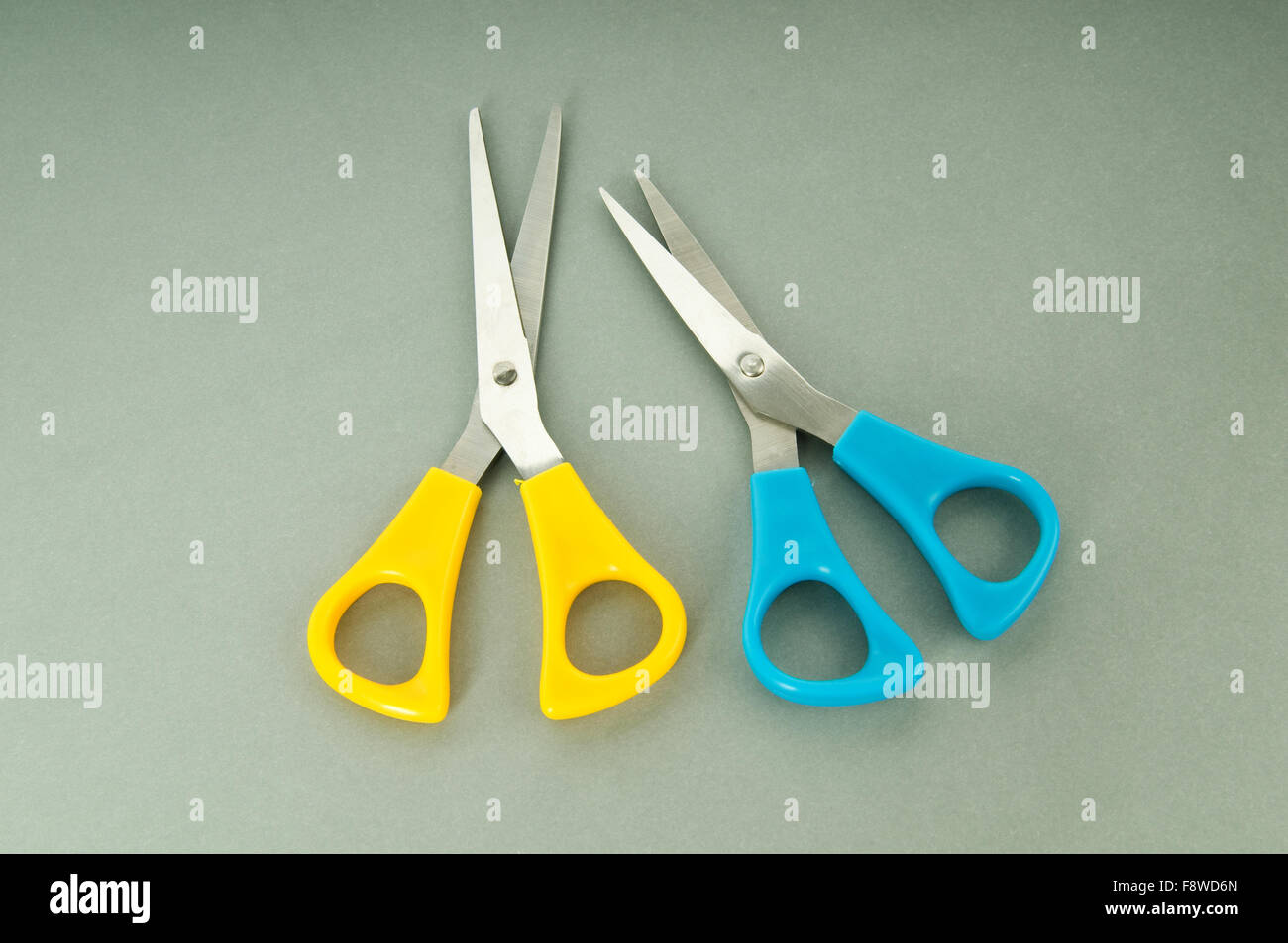 Colorful scissors on the color paper background Stock Photo - Alamy