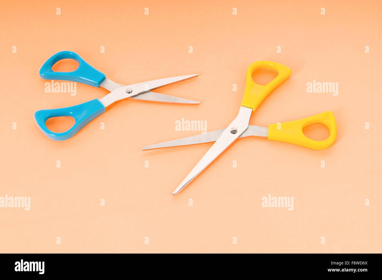Colorful scissors on the color paper background Stock Photo - Alamy