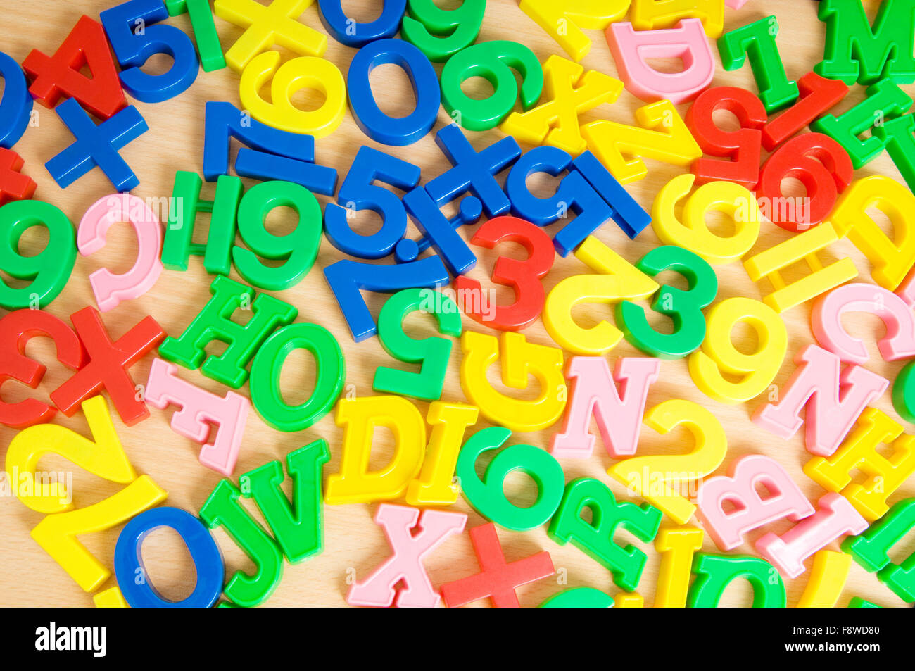 Children letters and digits on the table Stock Photo - Alamy