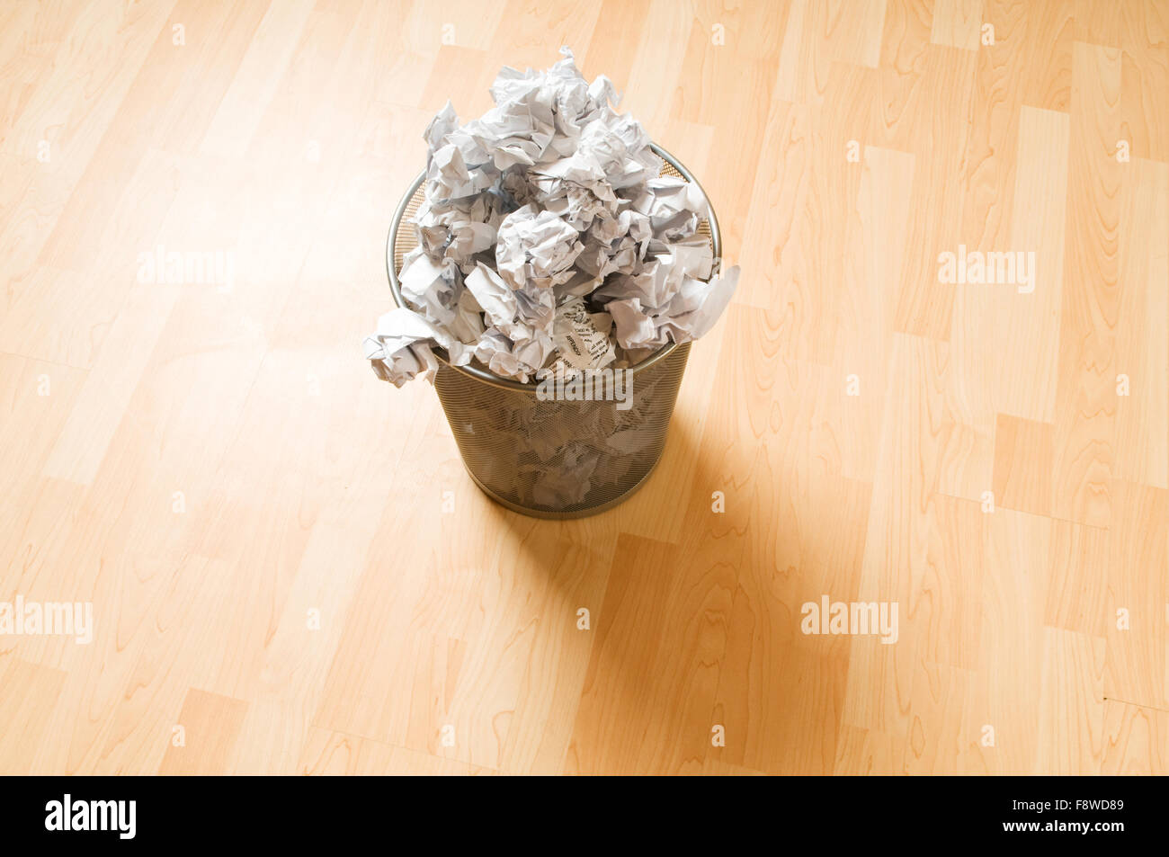Garbage bin with paper waste isolated on white Stock Photo - Alamy