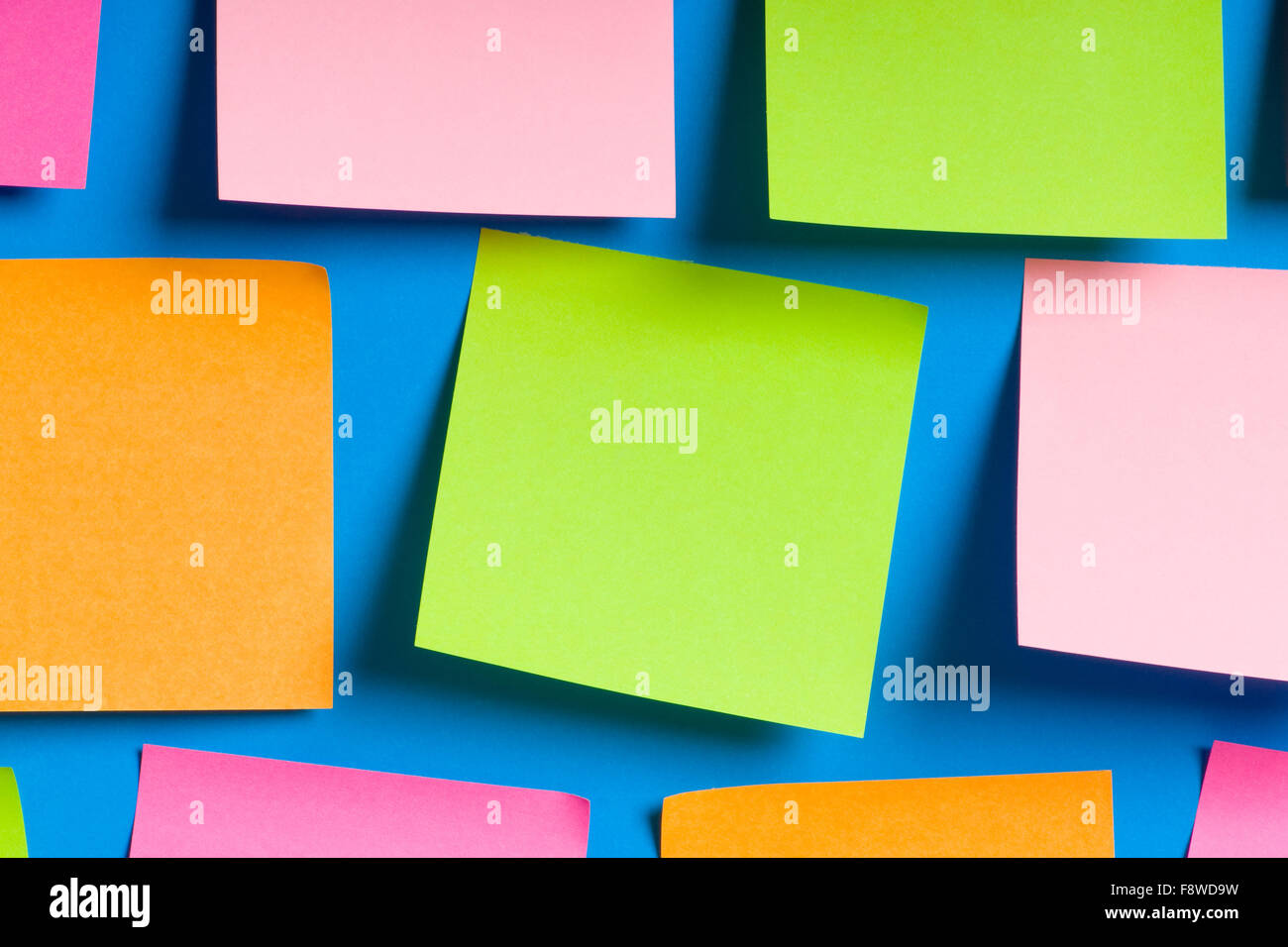 Reminder notes on the bright colorful paper Stock Photo - Alamy
