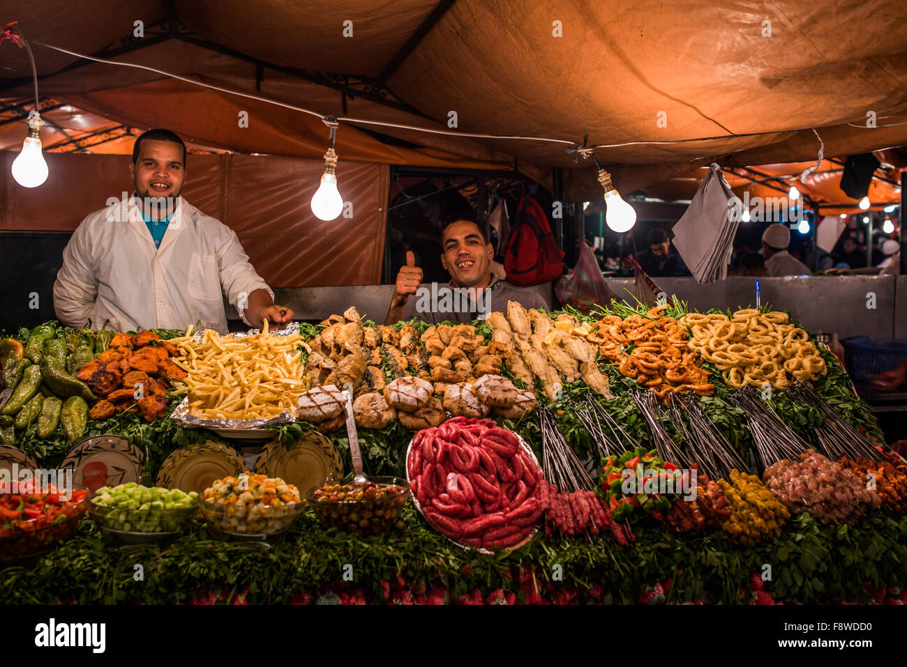 Moroccan men behind kebab stall on the Jemaa el fnaa food court in ...