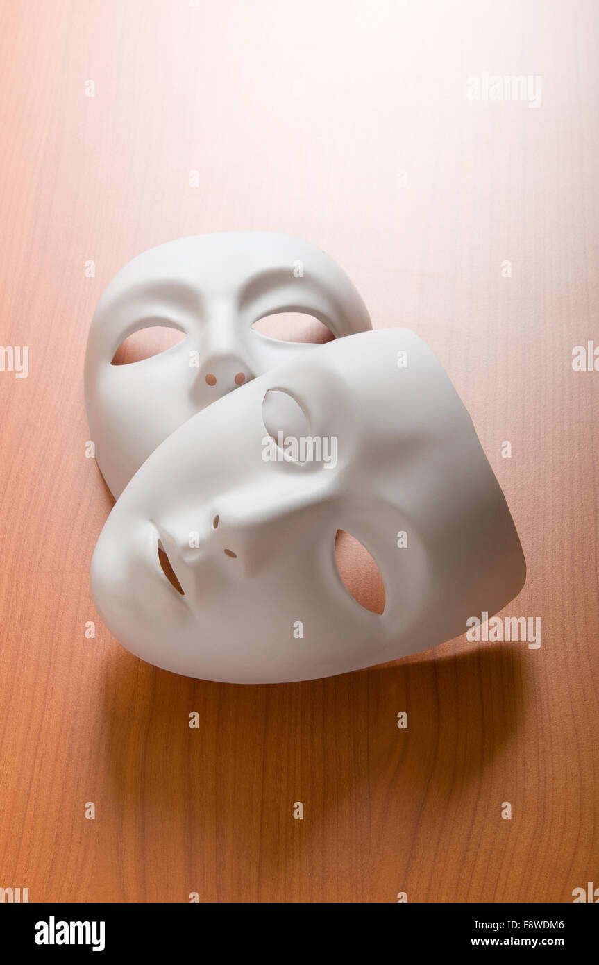 Theatre concept with the white plastic masks Stock Photo - Alamy