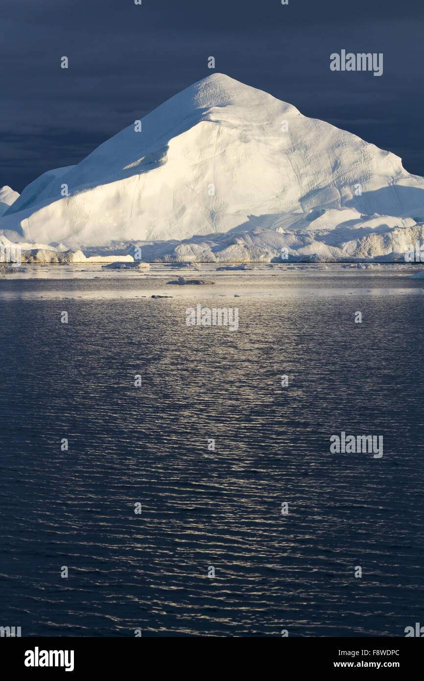 Iceberg in sunset Stock Photo - Alamy